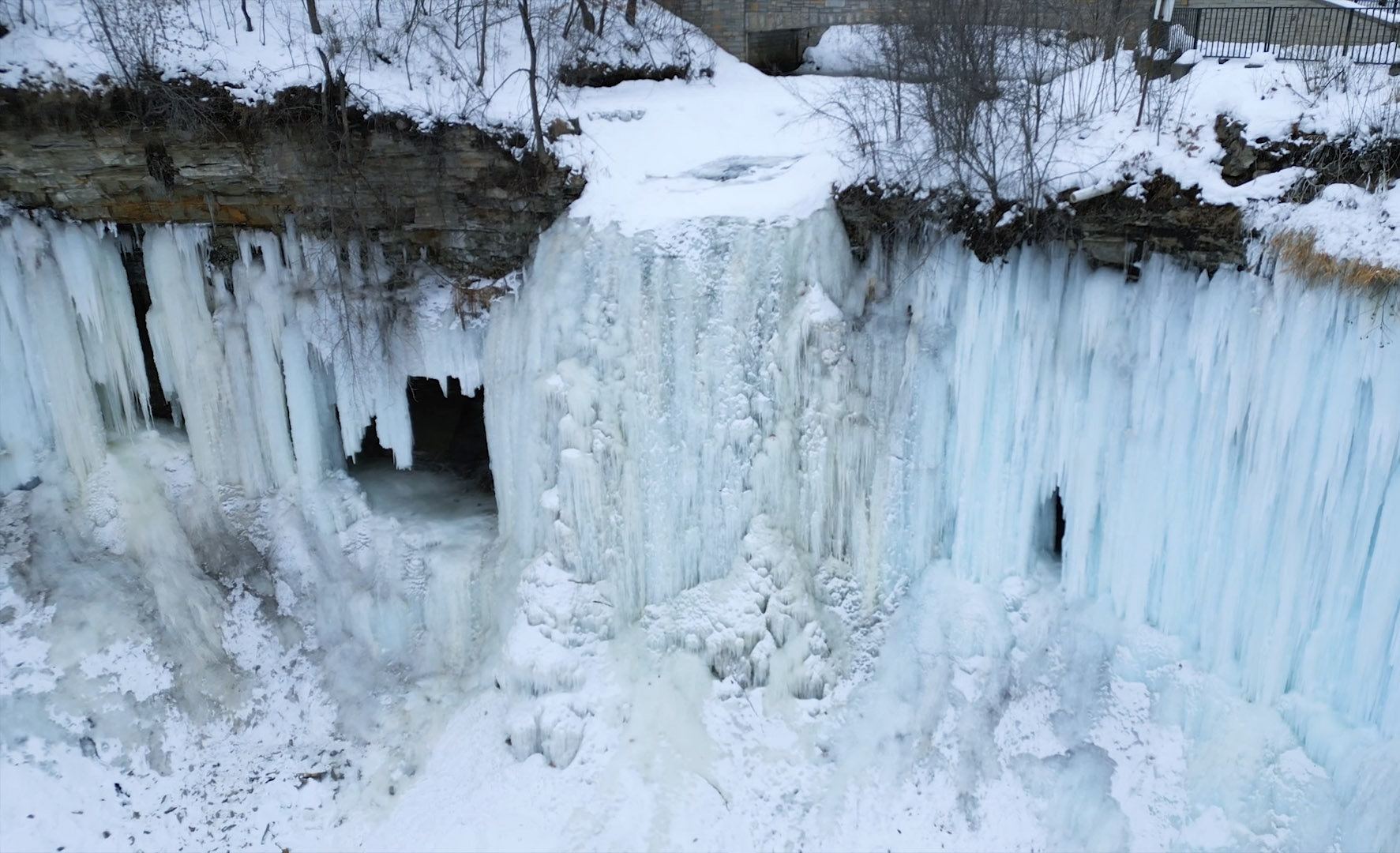 Drone Footage of a Frozen Waterfall - Moving Tree Media